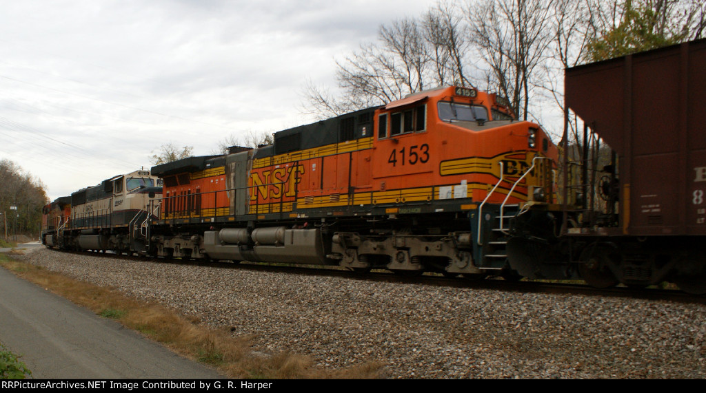 BNSF 4153 trails westbound oil train empties, K083
